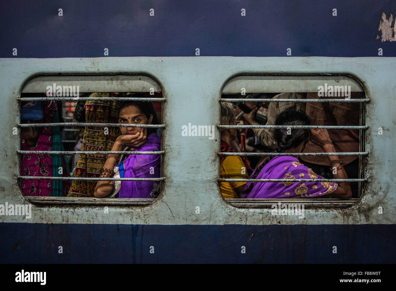 Looking out of doors or windows. Indian Railways, India Stock Photo - Alamy