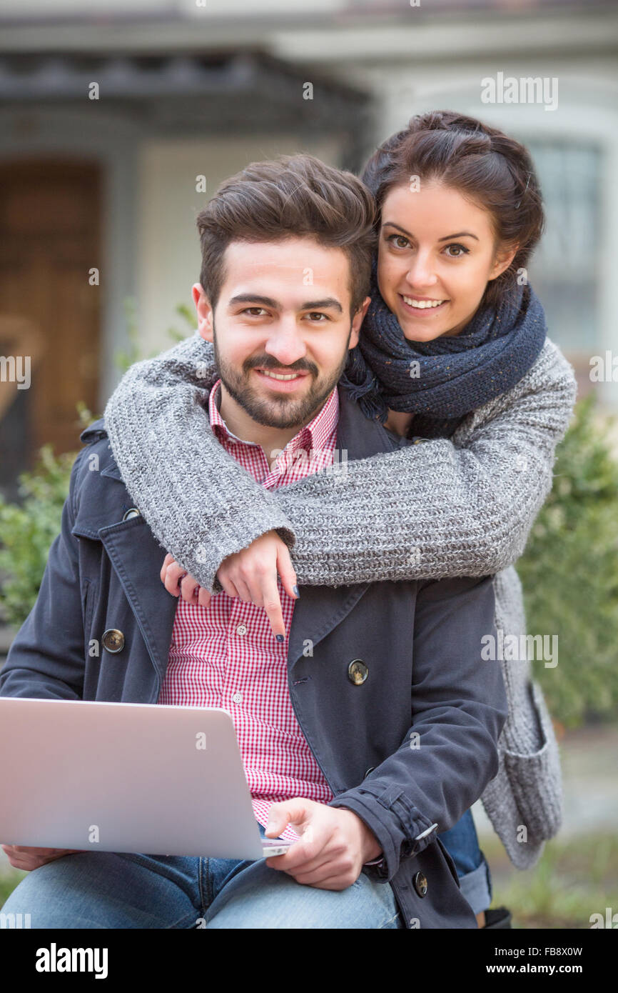 People hugging computer hi-res stock photography and images - Alamy