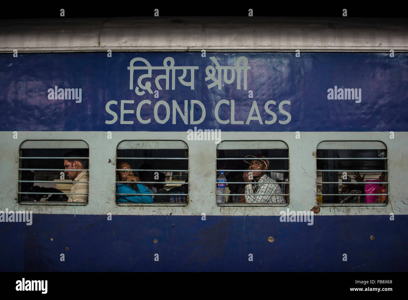 Looking out of doors or windows. Indian Railways, India Stock Photo - Alamy