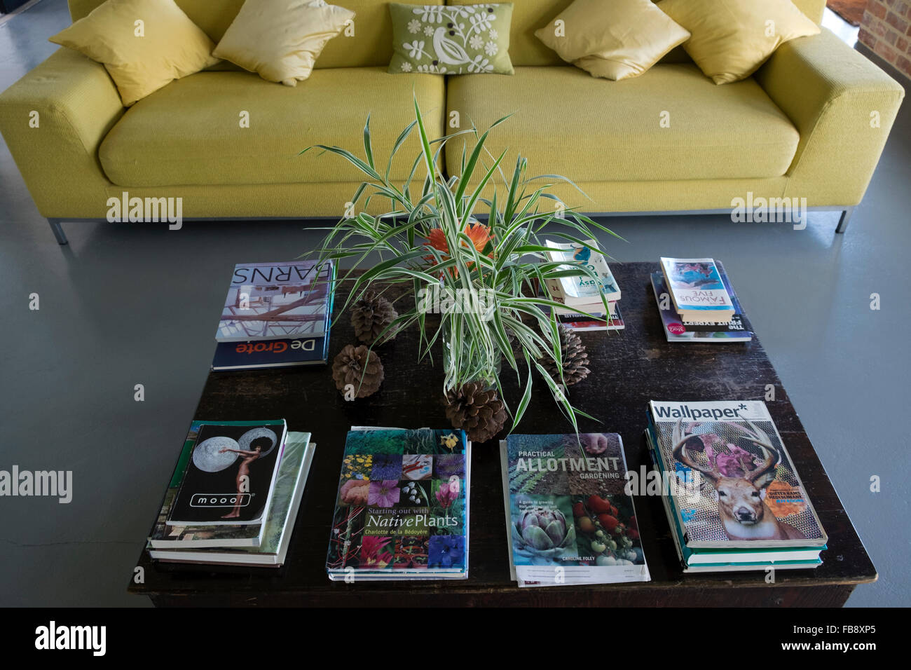 Coffee table with magazines Stock Photo - Alamy