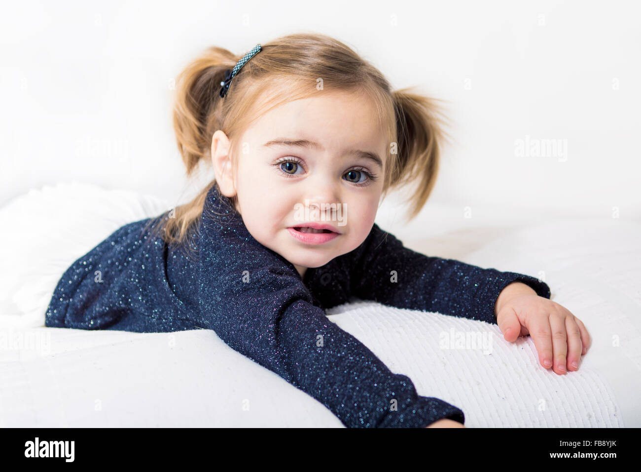 Little baby girl lay on the bed Stock Photo - Alamy