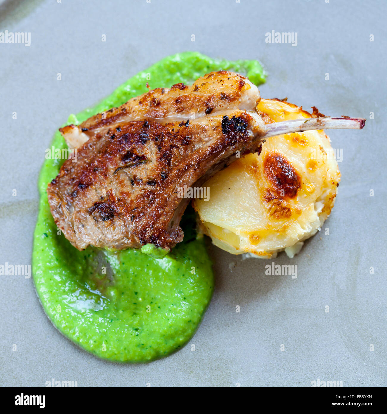 Lamb chop with peas puree and dauphinoise potatoes Stock Photo - Alamy