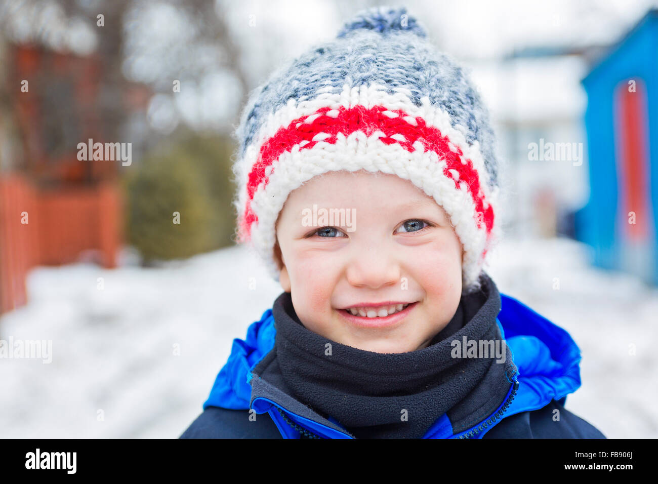 young boy outside in cold snow winter, dressed warmly and smiling Stock ...