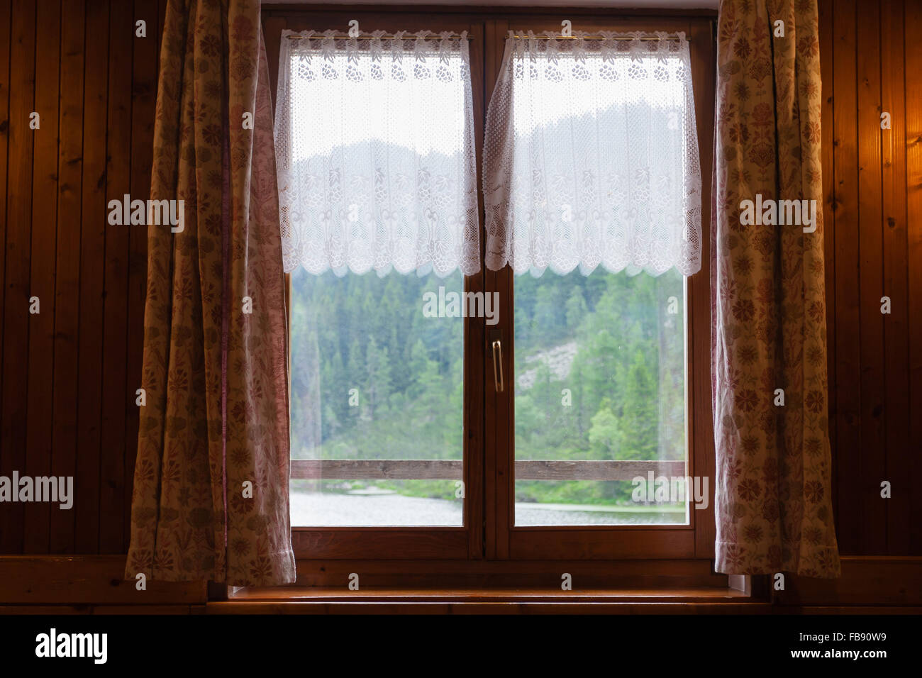 Mountain panorama over a closed window Stock Photo - Alamy