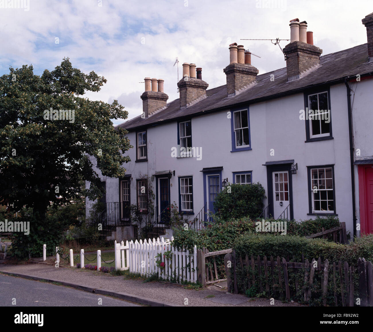 Exterior of a row of white Victorian terraced cottages Stock Photo - Alamy