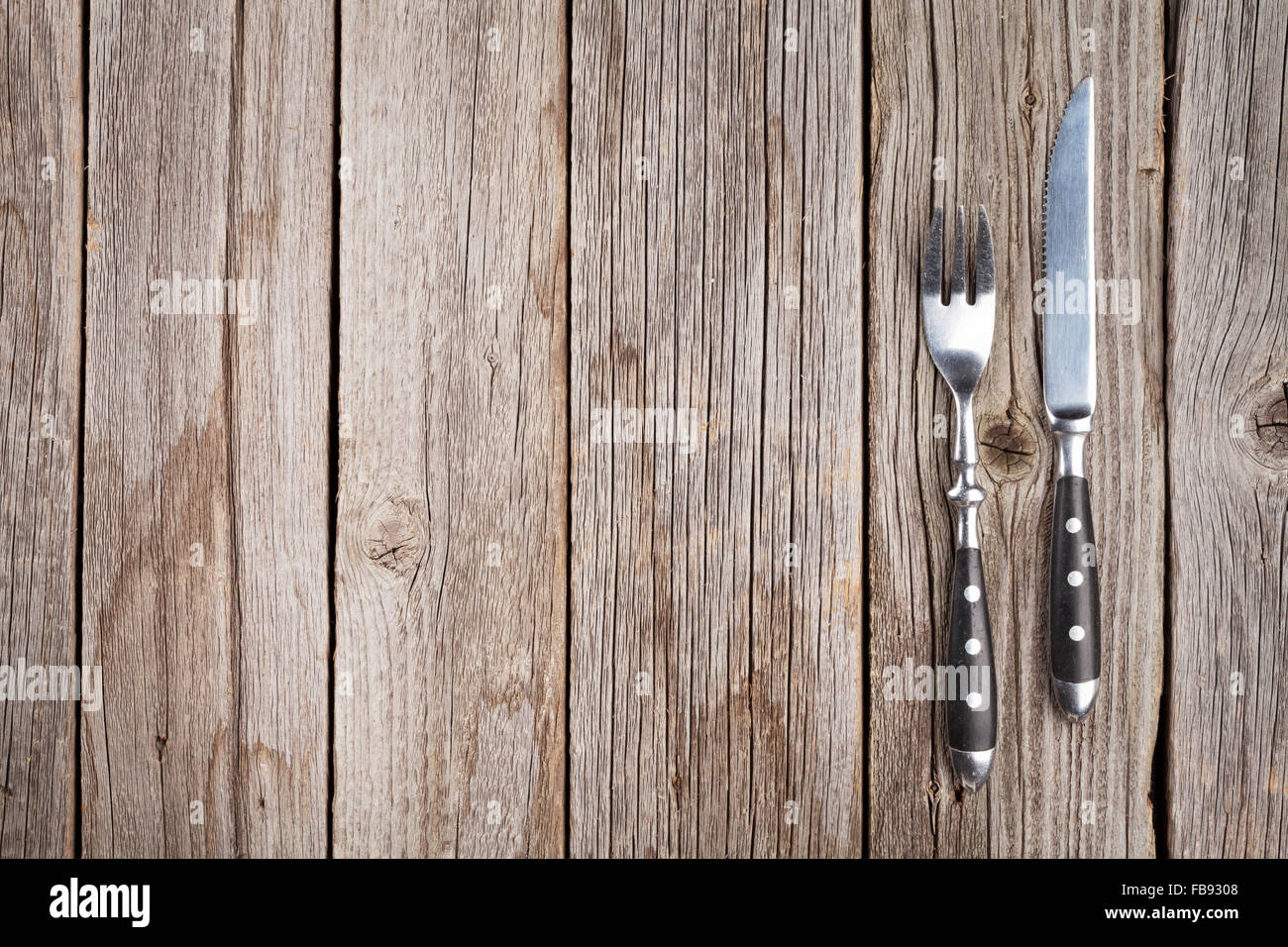 Silverware on wooden table. Top view with copy space Stock Photo - Alamy
