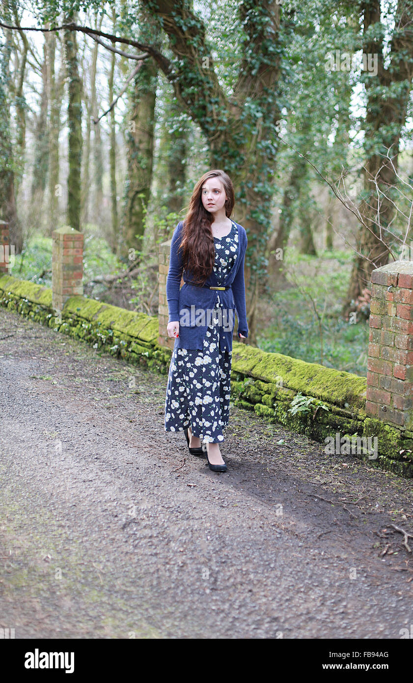 Woman walking down country lane hi-res stock photography and images - Alamy