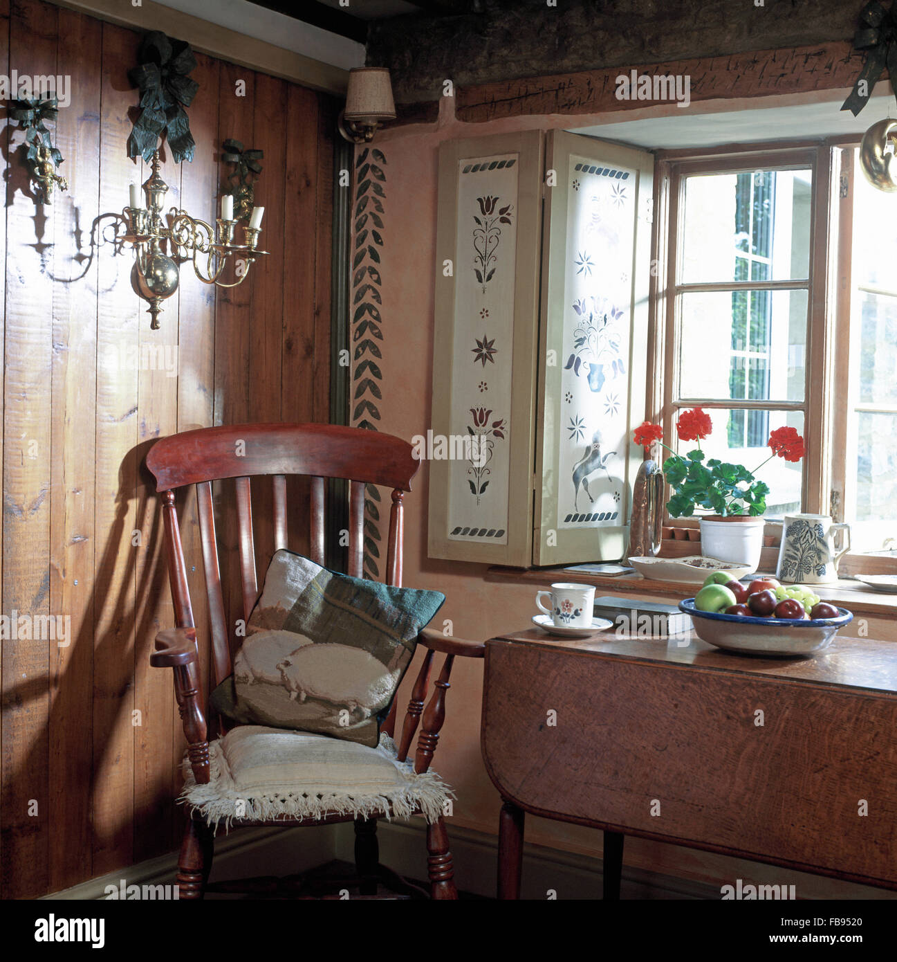Antique Windsor chair in corner of paneled cottage dining room with ...
