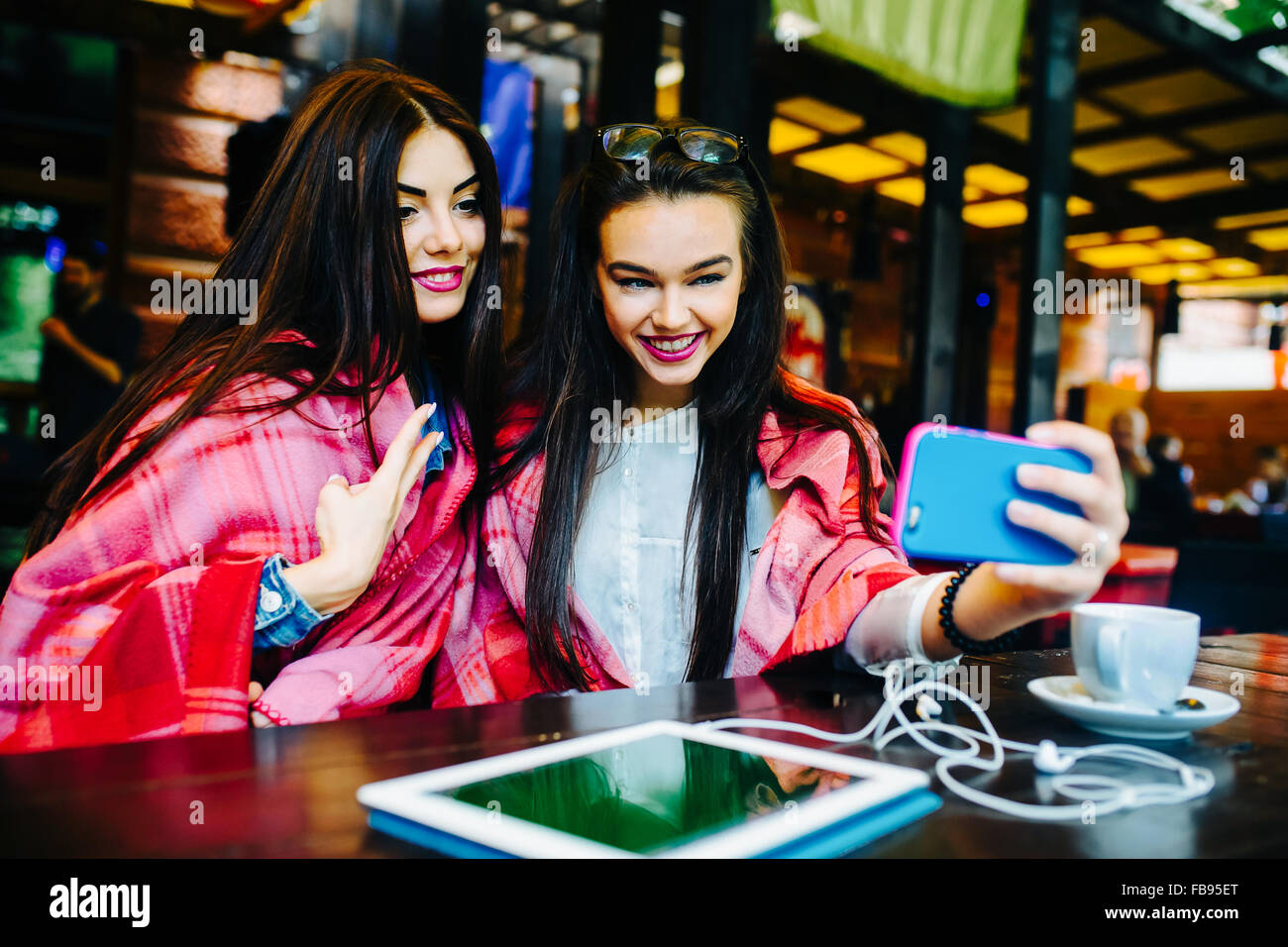 two close friends make selfie in the cafe Stock Photo - Alamy