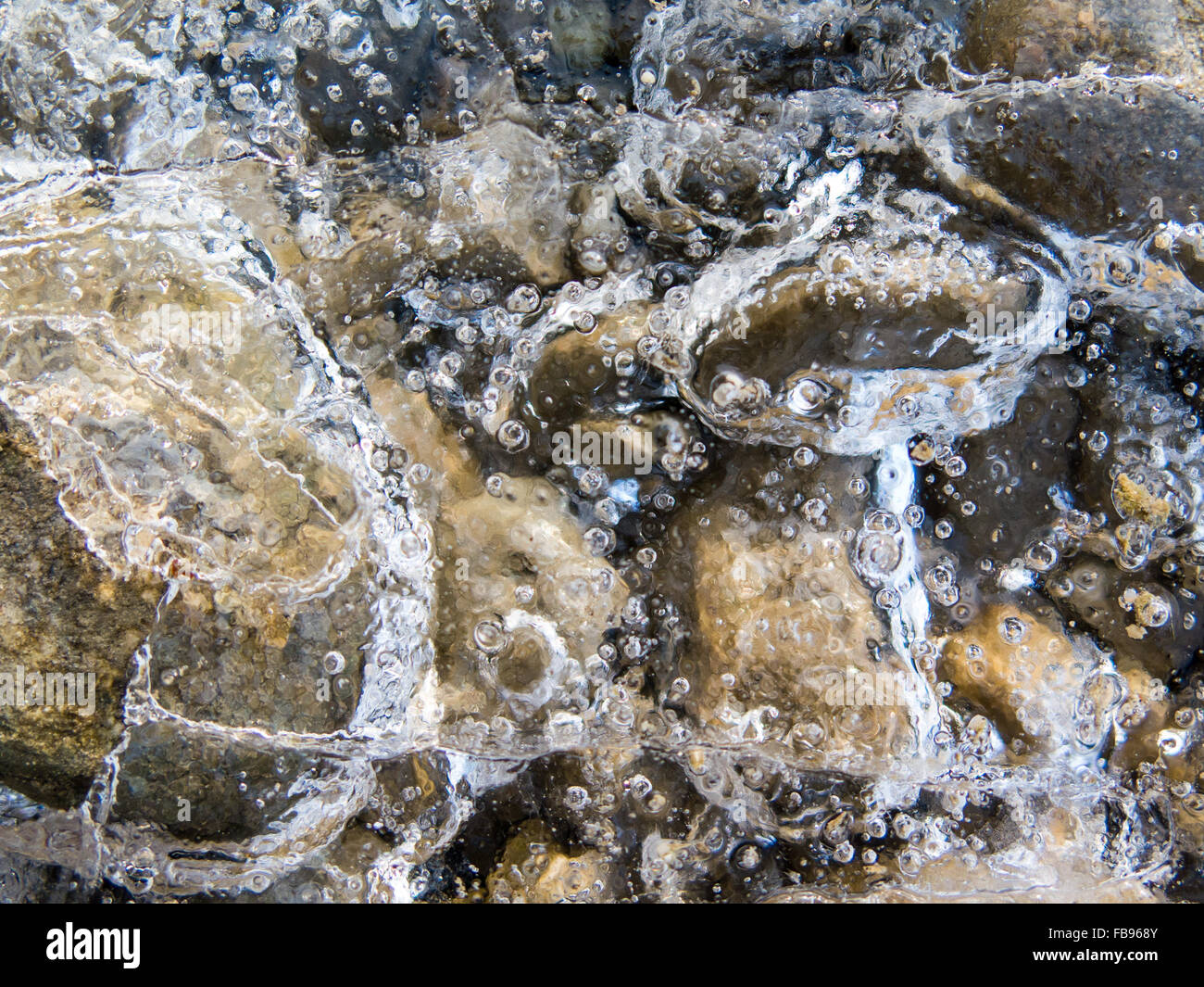 Rocks covered with ice with air bubbles Stock Photo - Alamy