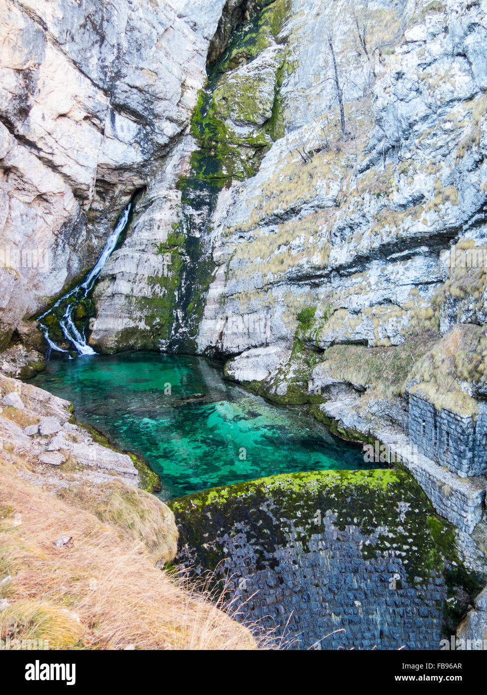 Small waterfall falling in lake with a dam Stock Photo - Alamy