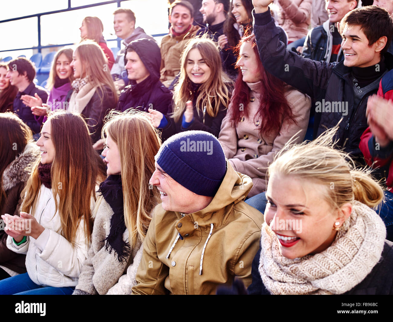 Sport fans clapping and singing on tribunes Stock Photo - Alamy