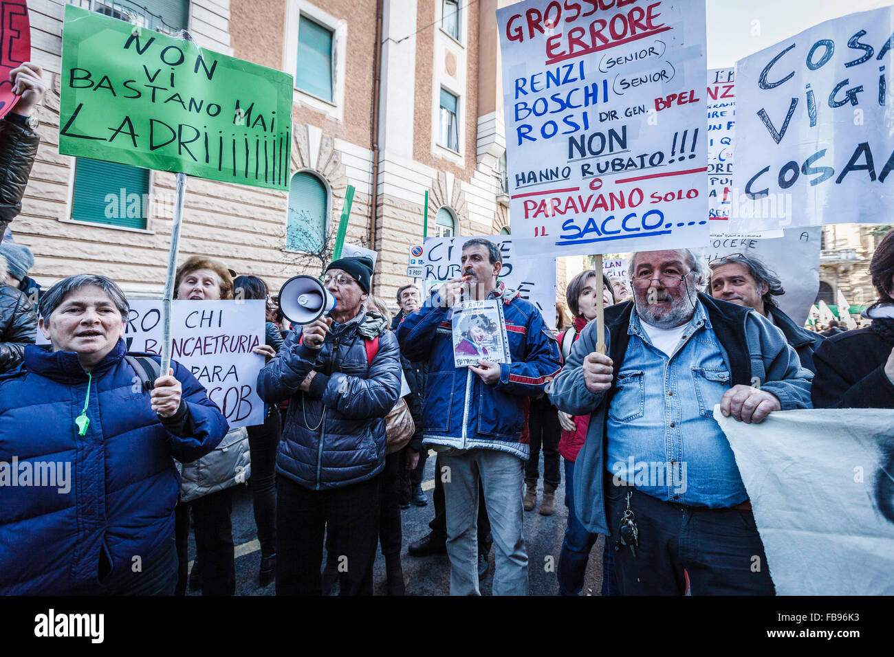 Rome, Italy. 12th Jan, 2016. Protesters shout slogans and hold banners ...