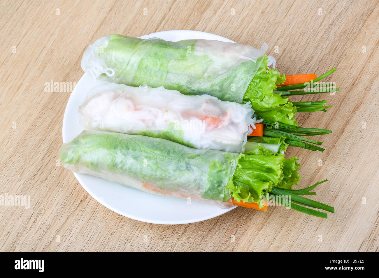 Asian traditional spring rolls on the wood background Stock Photo - Alamy