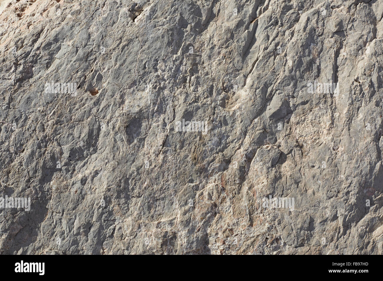 Natural rough stone background in sunlight Stock Photo - Alamy