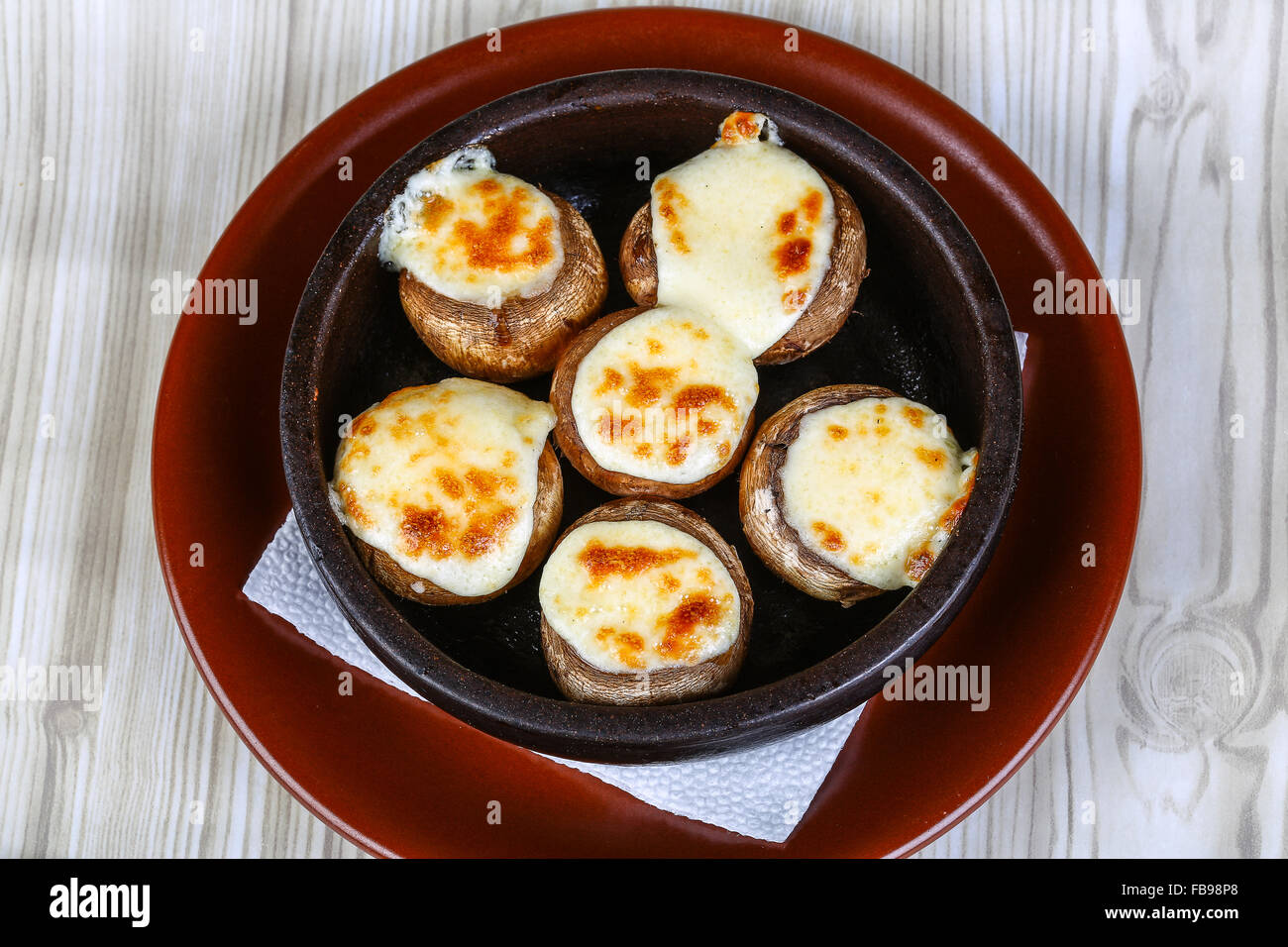 Baked Stuffed champignon with hard cheese and spices Stock Photo - Alamy