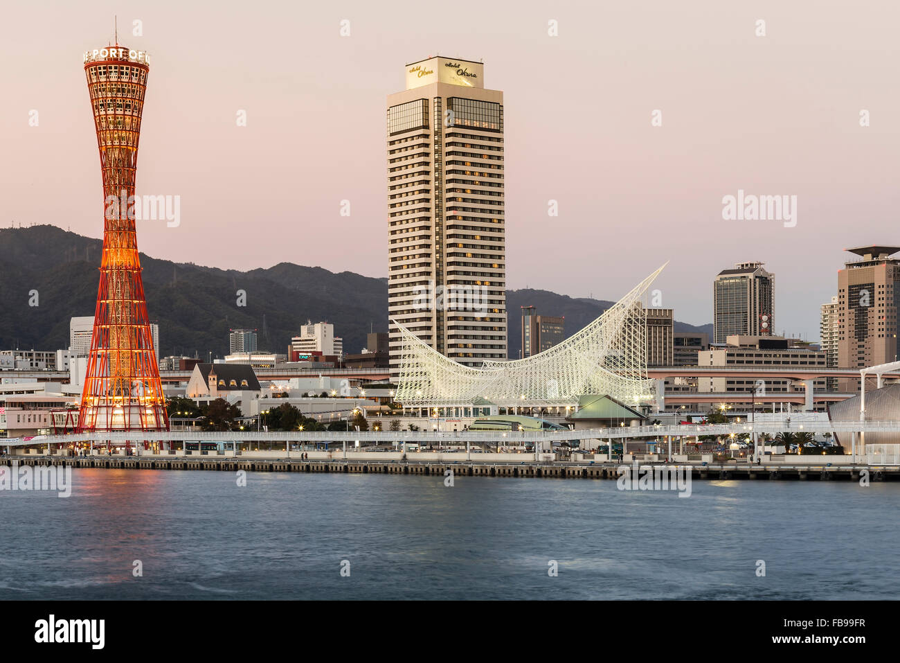 Kobe Port Tower and buildings at night across harbor Stock Photo - Alamy