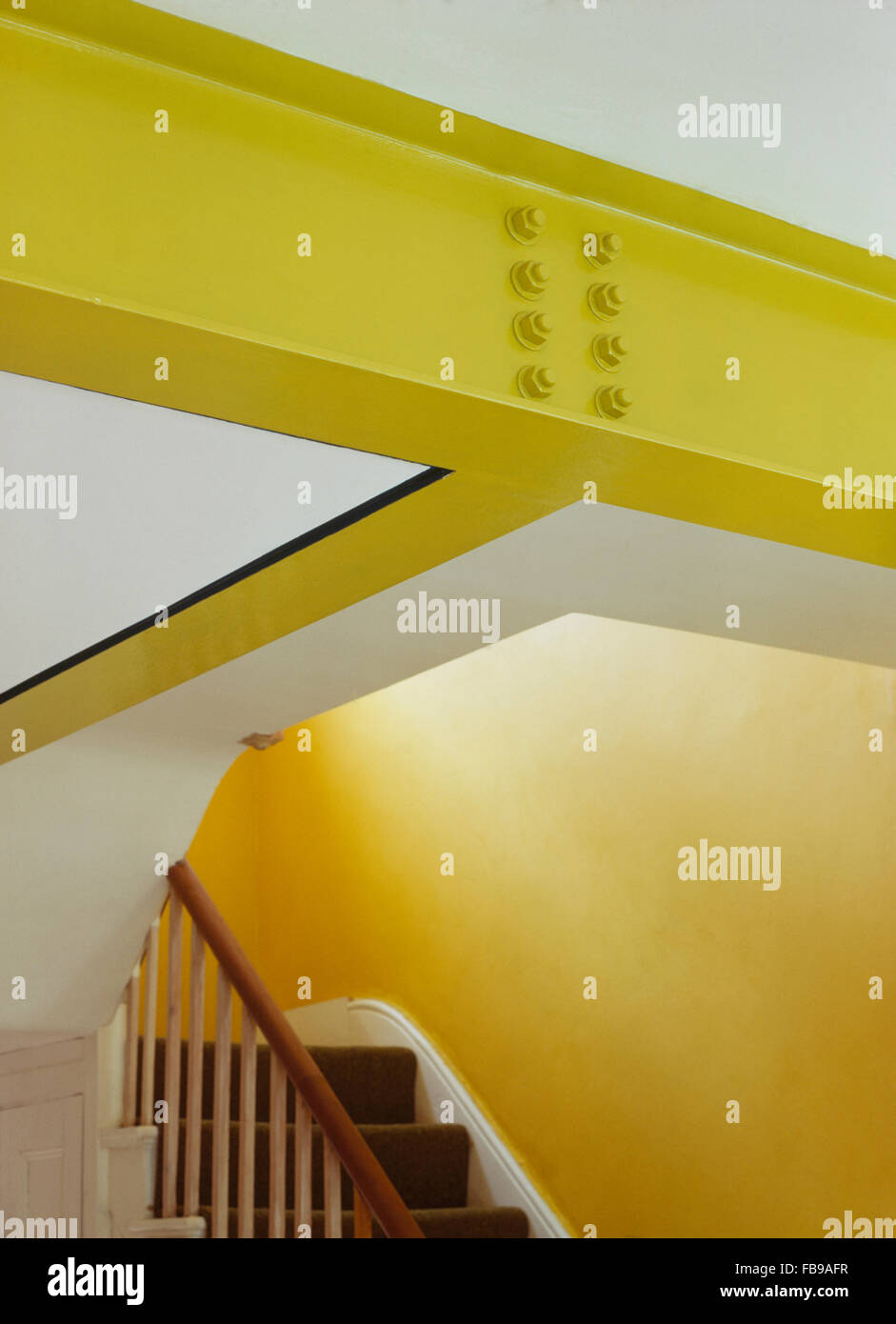 Lime green RSJ in a yellow sixties hall Stock Photo - Alamy