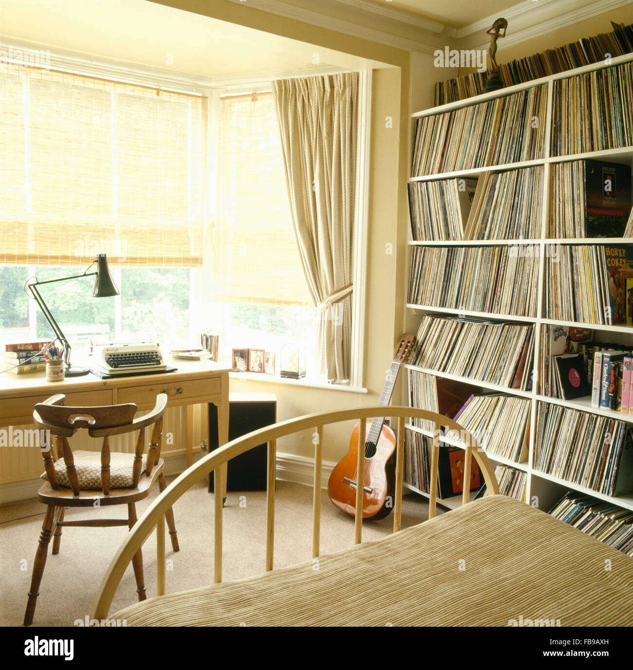 Pinoleum blinds on window behind desk and chair in eighties study ...