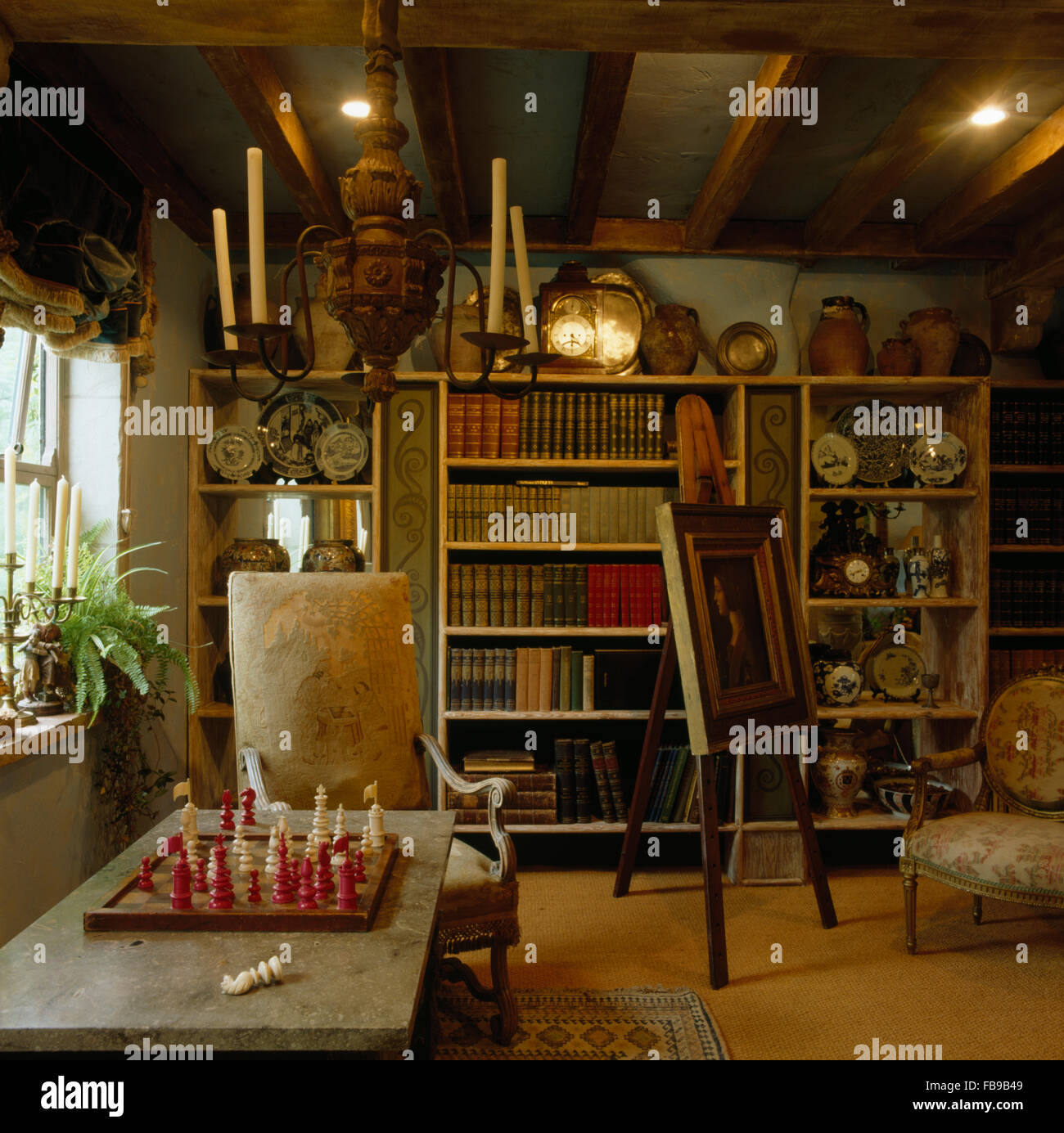 Chess set on table in eighties rustic style living room with a fitted ...