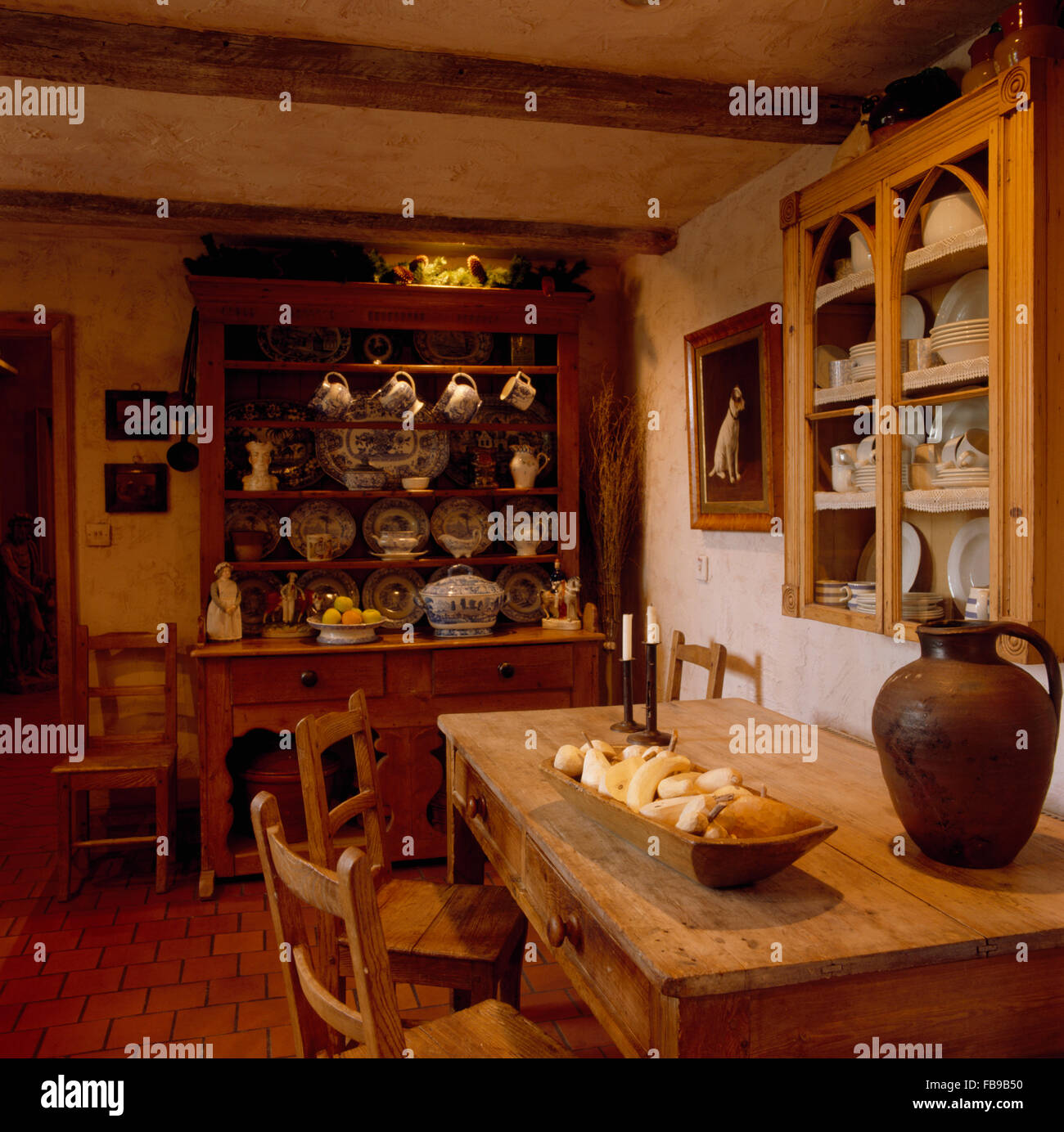 Antique dresser and pine table in rustic country dining room Stock ...
