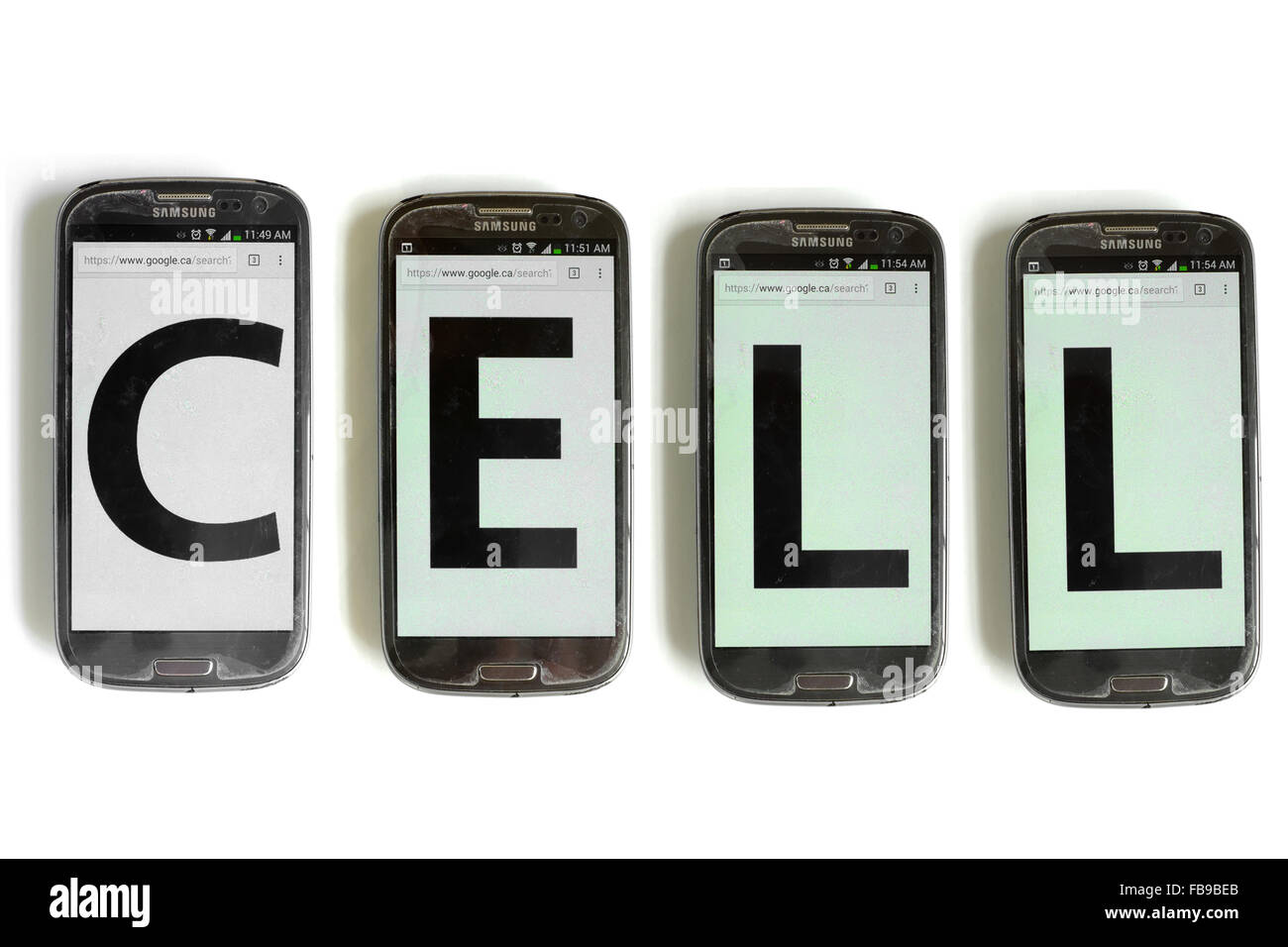 Cell written on the screens of smartphones photographed against a white ...
