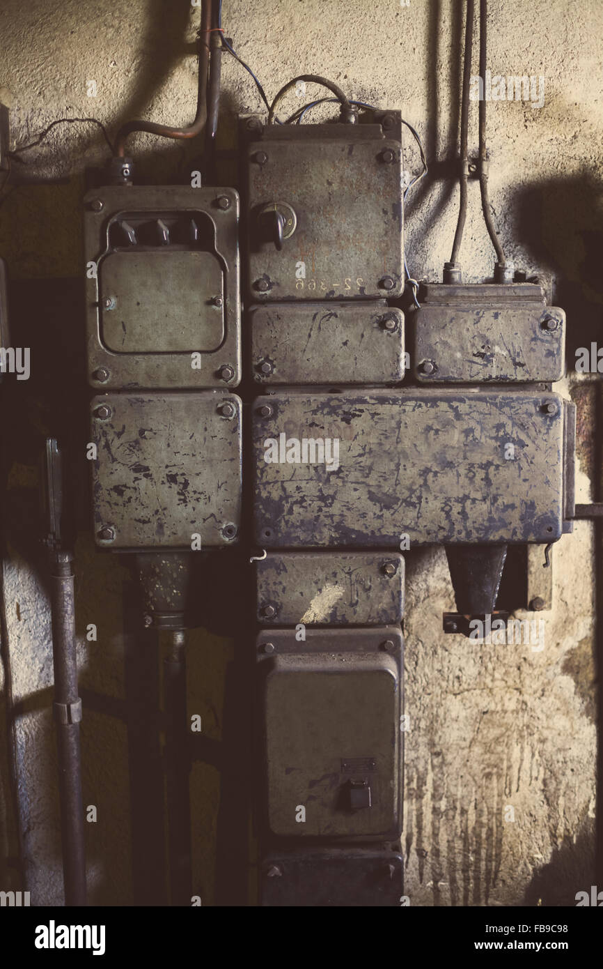Color image of a rusty electrical system on a wall Stock Photo - Alamy
