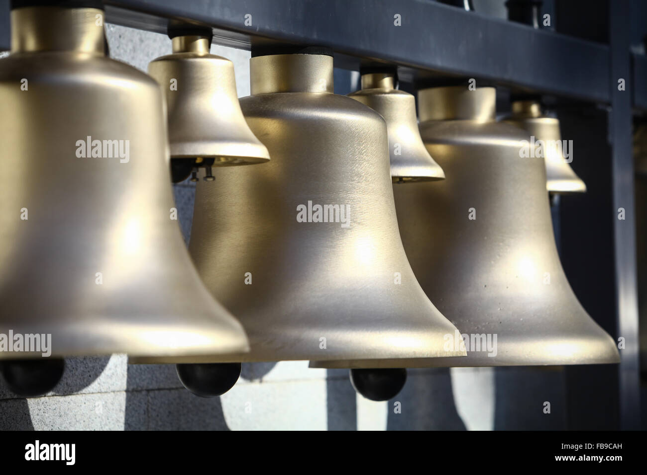 Color image of some various sized bells in a row Stock Photo - Alamy