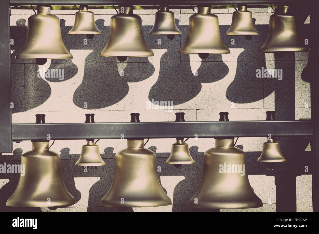 Color image of some various sized bells in a row Stock Photo - Alamy
