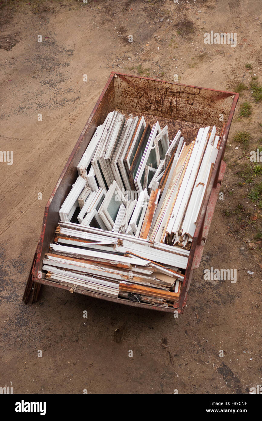 Refuse from building renovations in a construction bin Stock Photo - Alamy