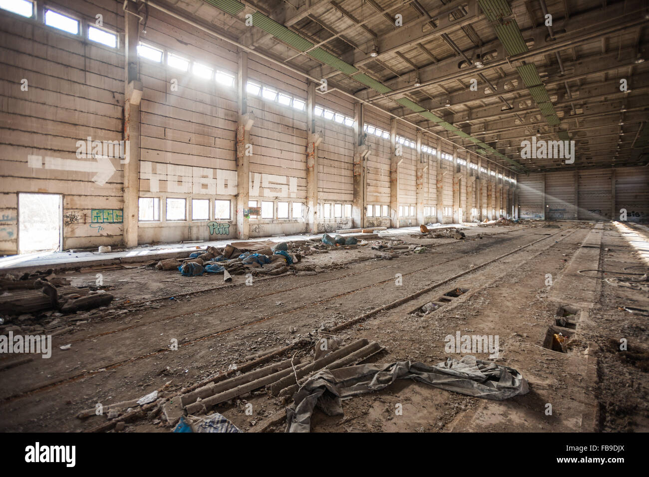 Abandoned warehouse with broken windows on a sunny day Stock Photo - Alamy