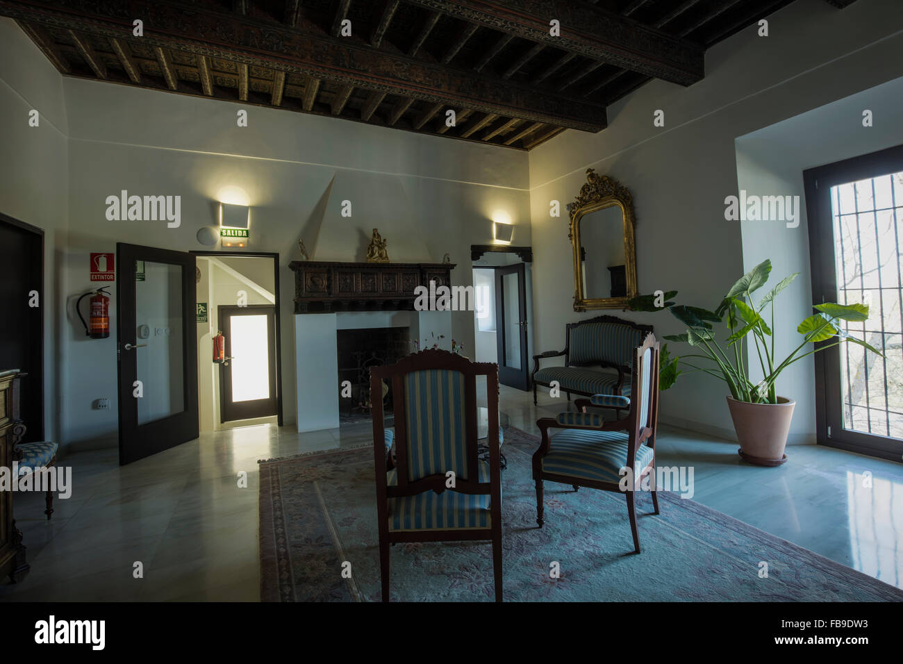Interior of a Spanish lounge complete with chairs and a plant pot Stock ...