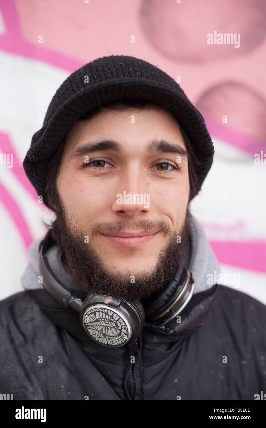 Oliver Bock aka 153 Design at work on a street art mural in Frankfurt ...