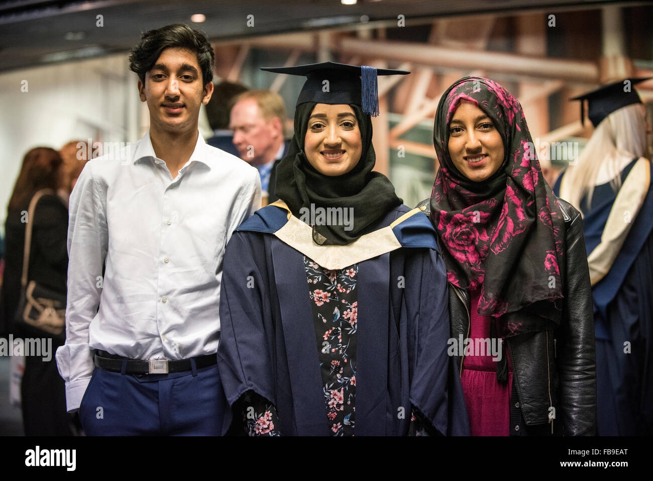 Young muslim brother and sisters pose for photo, graduation ceremony UK ...