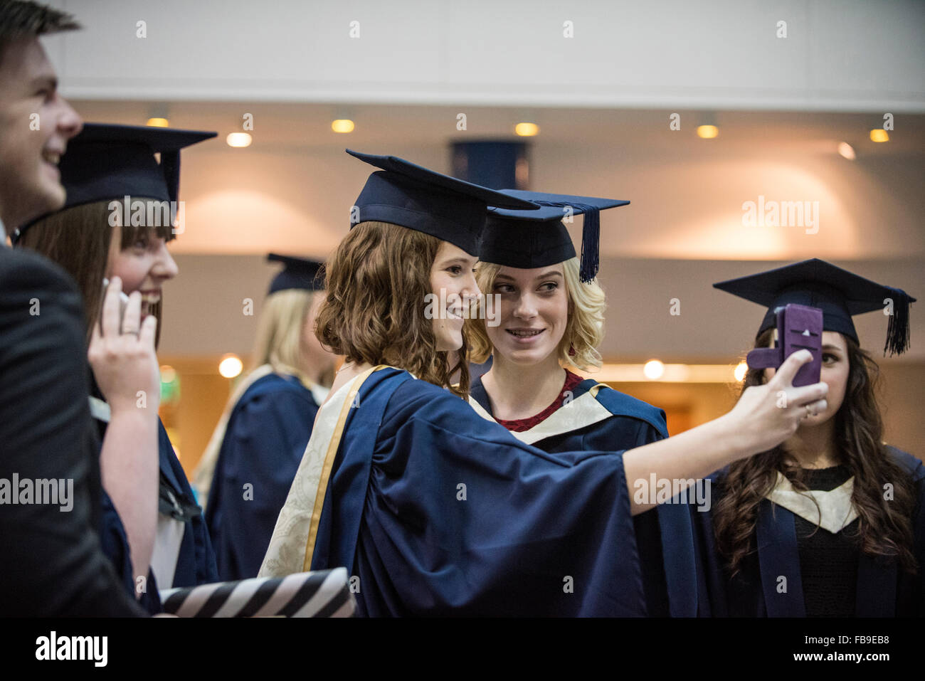 Young happy female graduands take selfie, graduation ceremony, UK Stock ...