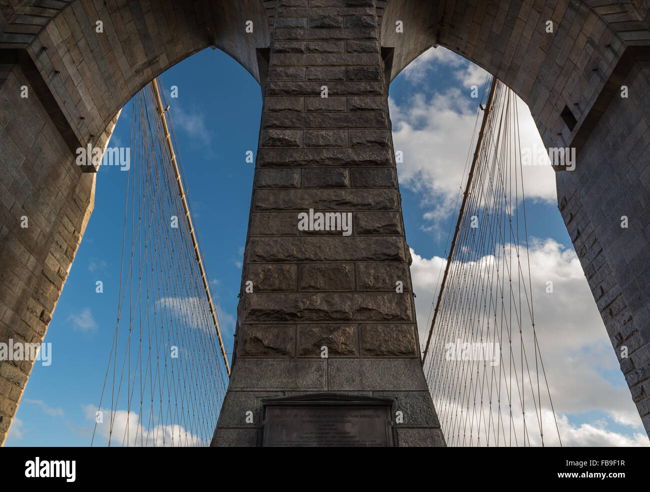 Closeup of one of the towers of Brooklyn Bridge with granite and ...