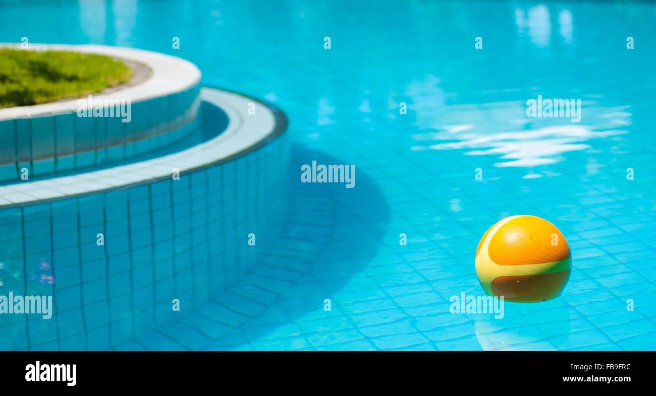 The bright yellow ball in the pool Stock Photo - Alamy