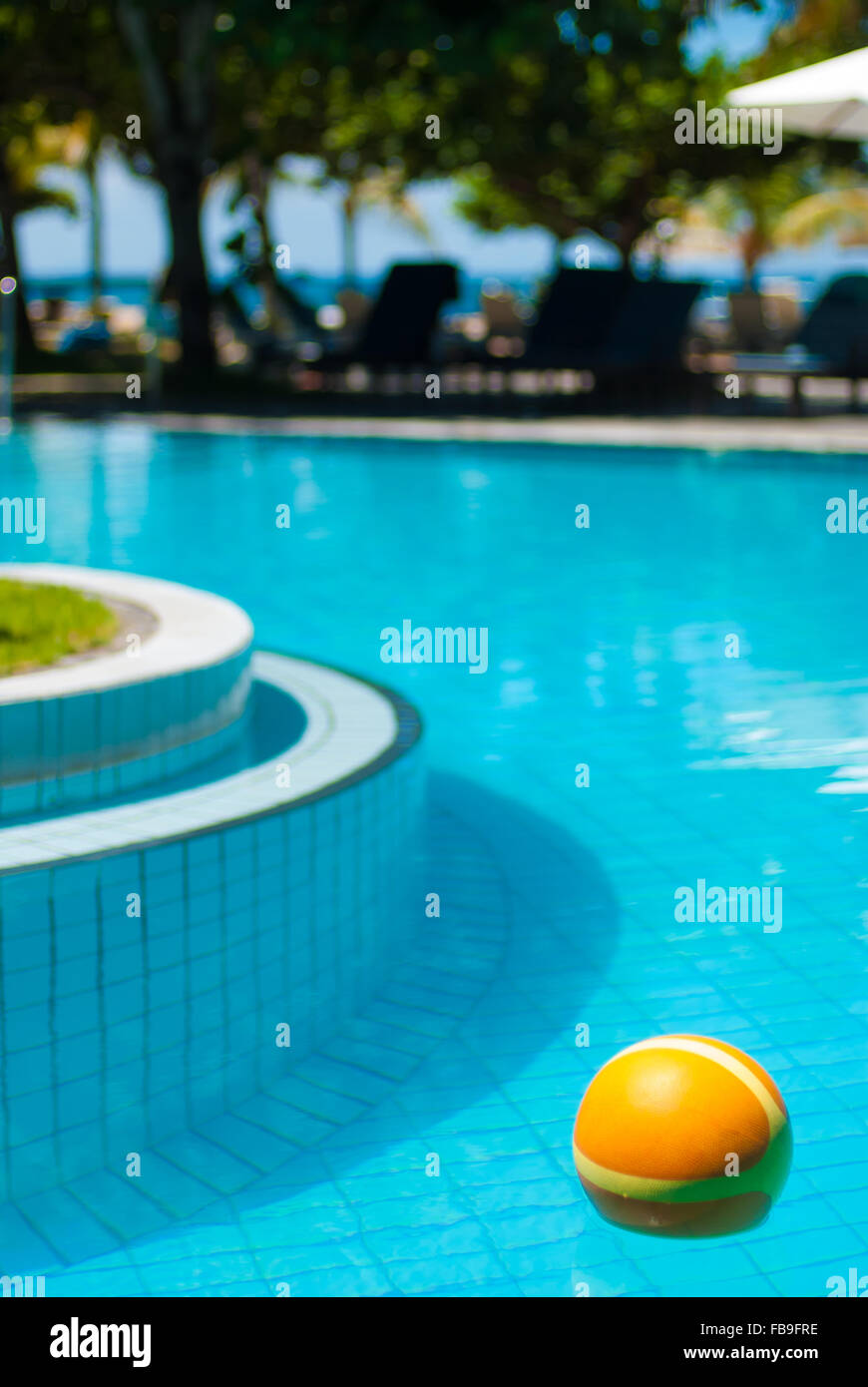 The bright yellow ball in the pool Stock Photo - Alamy