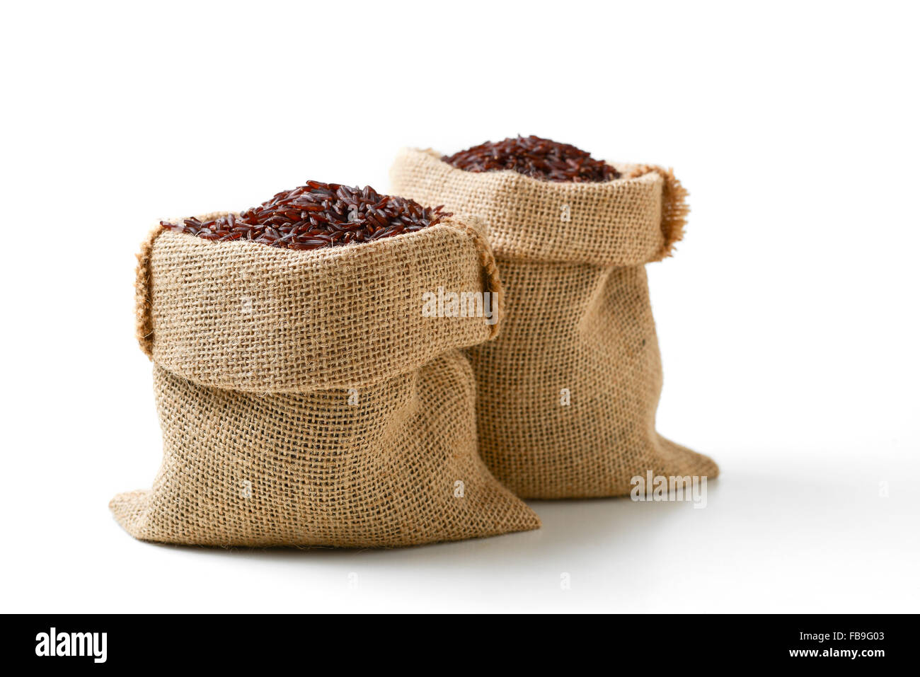 red rice in sack bag Stock Photo - Alamy