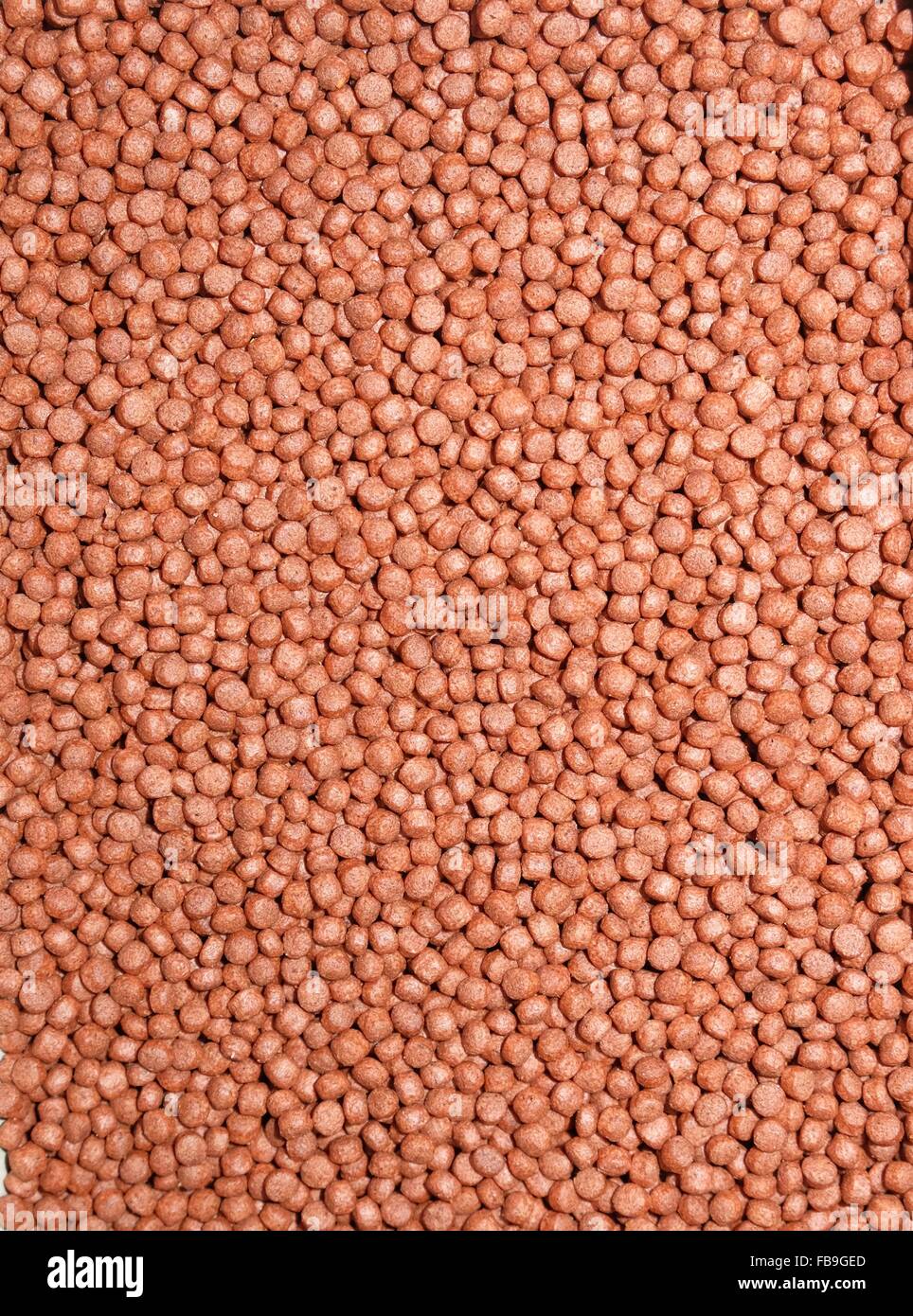 Granulated food for aquarium fish Stock Photo - Alamy