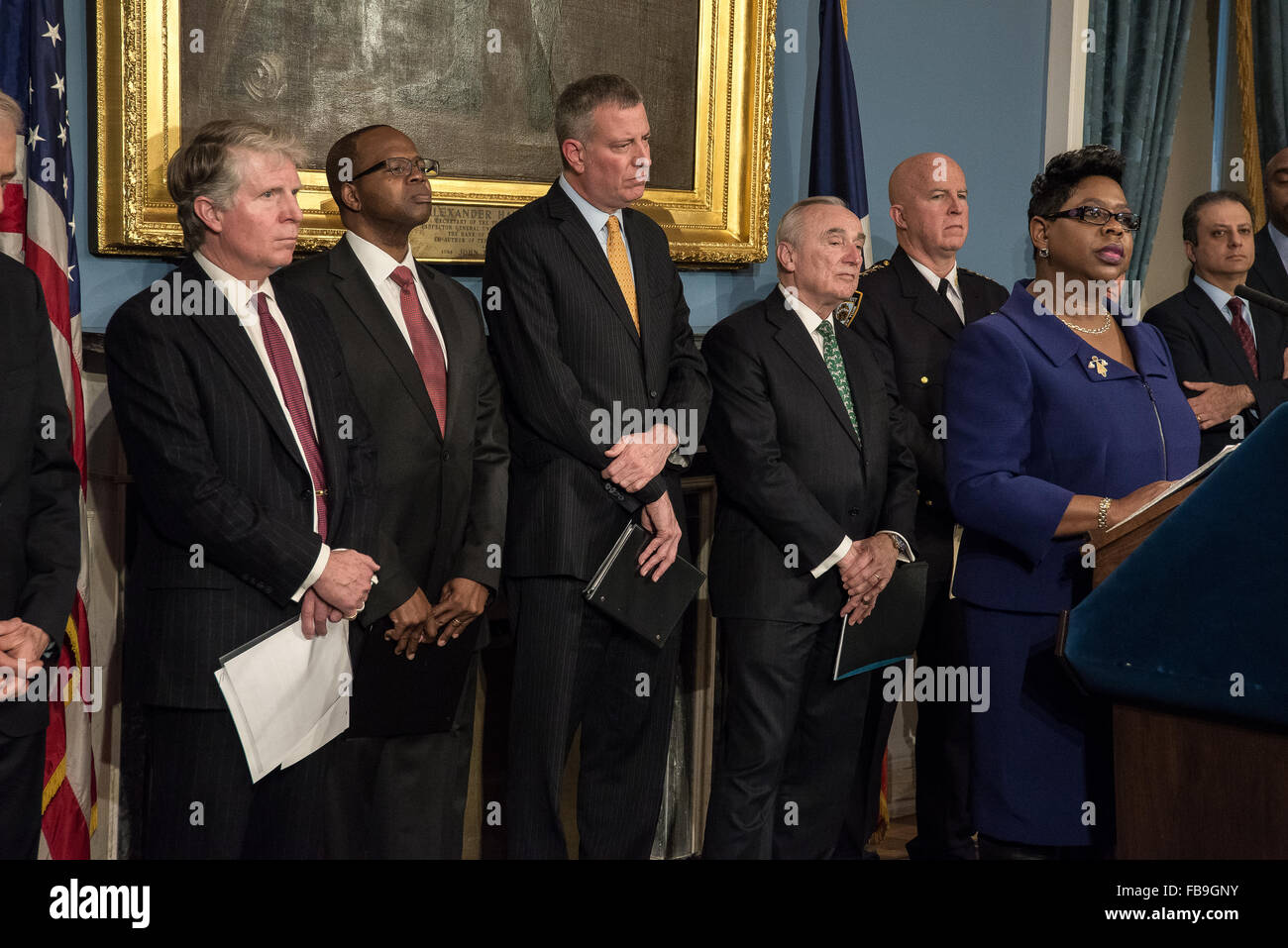 Mayor de Blasio (center) and fellow attendees listen as Bronx District ...