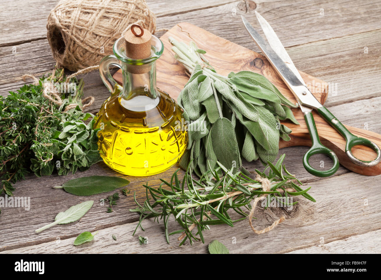 Fresh garden herbs and condiments on wooden table Stock Photo - Alamy