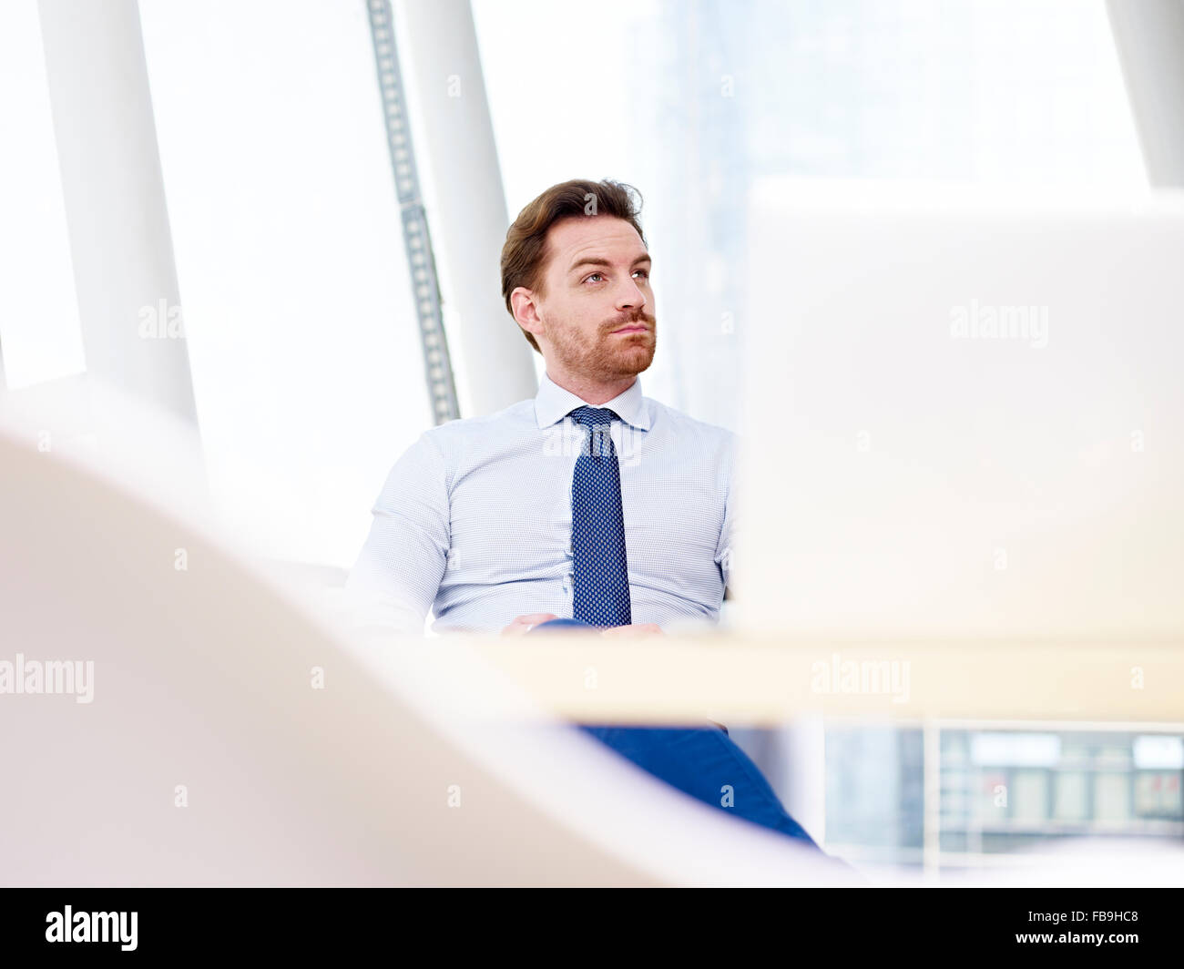 business executive sitting in office Stock Photo - Alamy