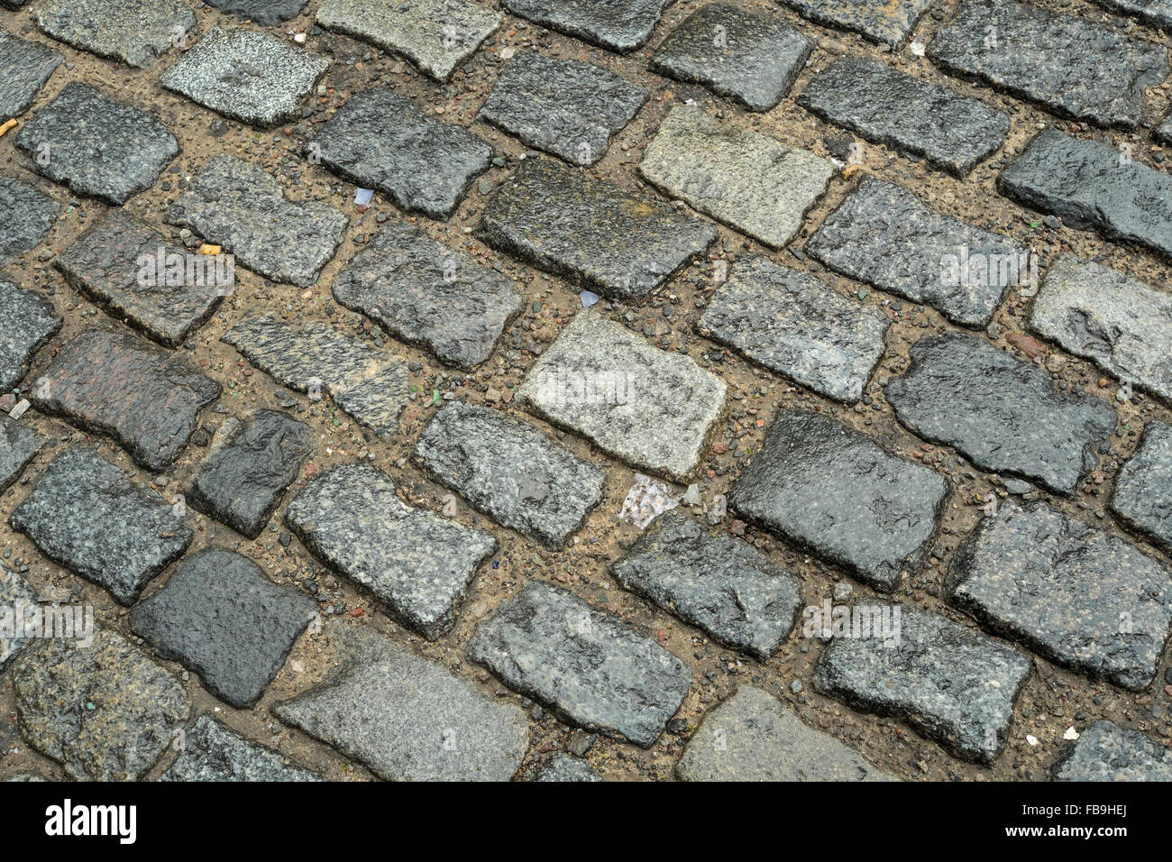 Full frame take of a wet cobblestone pavement Stock Photo - Alamy