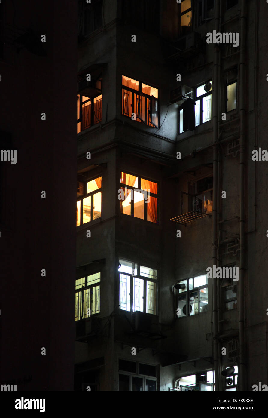 It's a photo of some flats view from outside by night. It's the evening ...