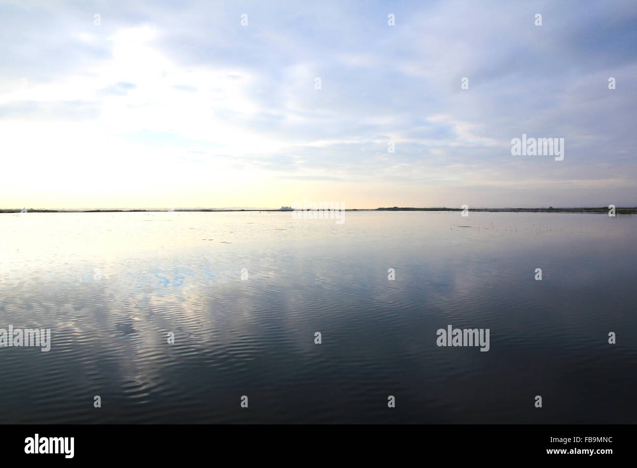 lake landscape with cloud reflections Stock Photo - Alamy