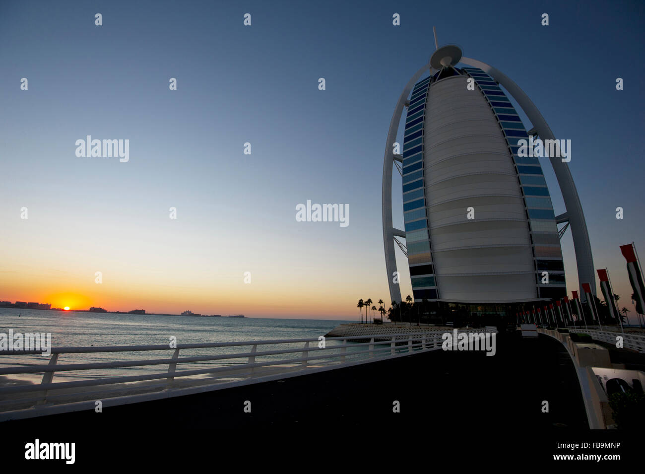 High rise building in Dubai and sunset Stock Photo - Alamy