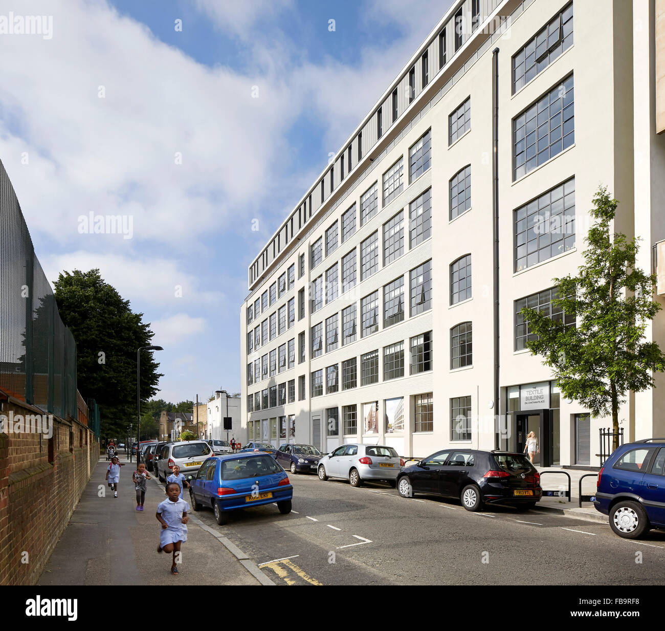 Perspective of building conversion and street with children running ...