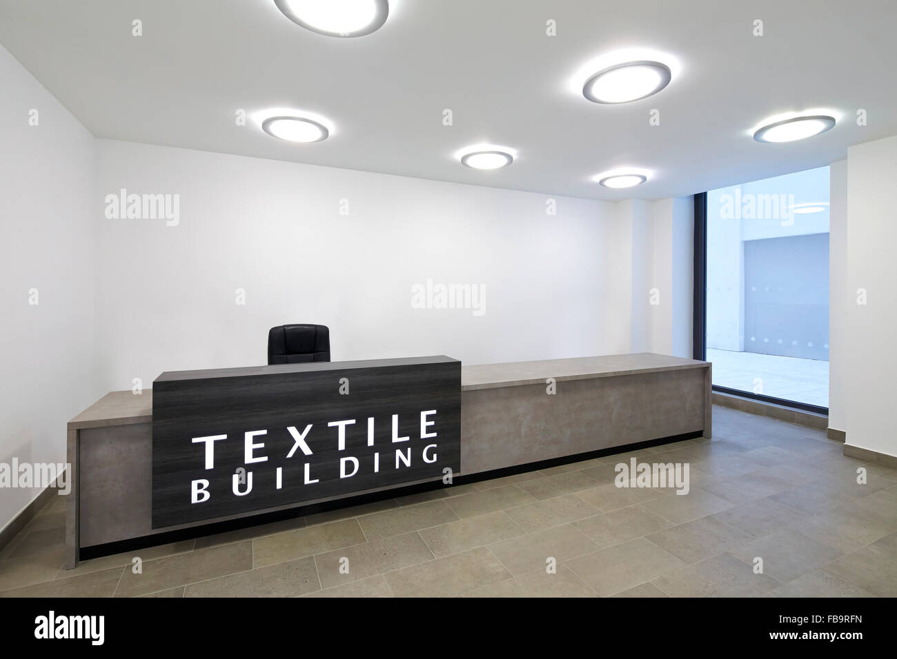 Reception desk in foyer. The Textile Building, London, United Kingdom ...