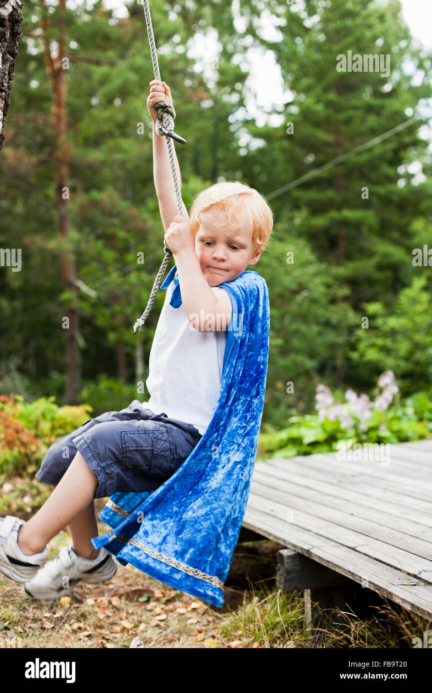 Child swinging on rope hi-res stock photography and images - Alamy